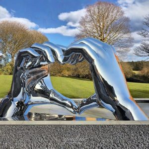Mirrored Metal Hand Sculpture with Heart